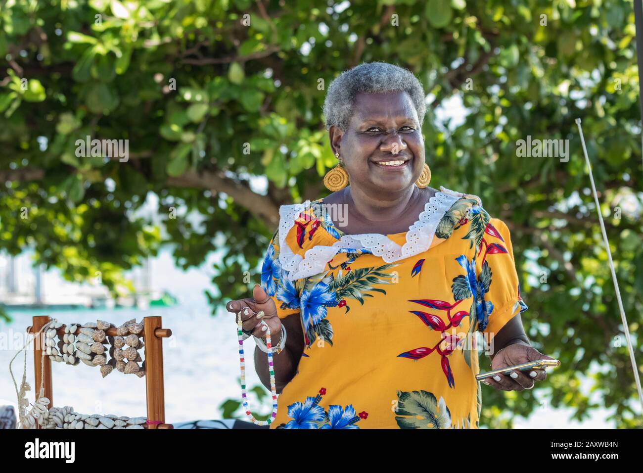 Portrait of a melanesian - australian artisan mature woman smiling ...