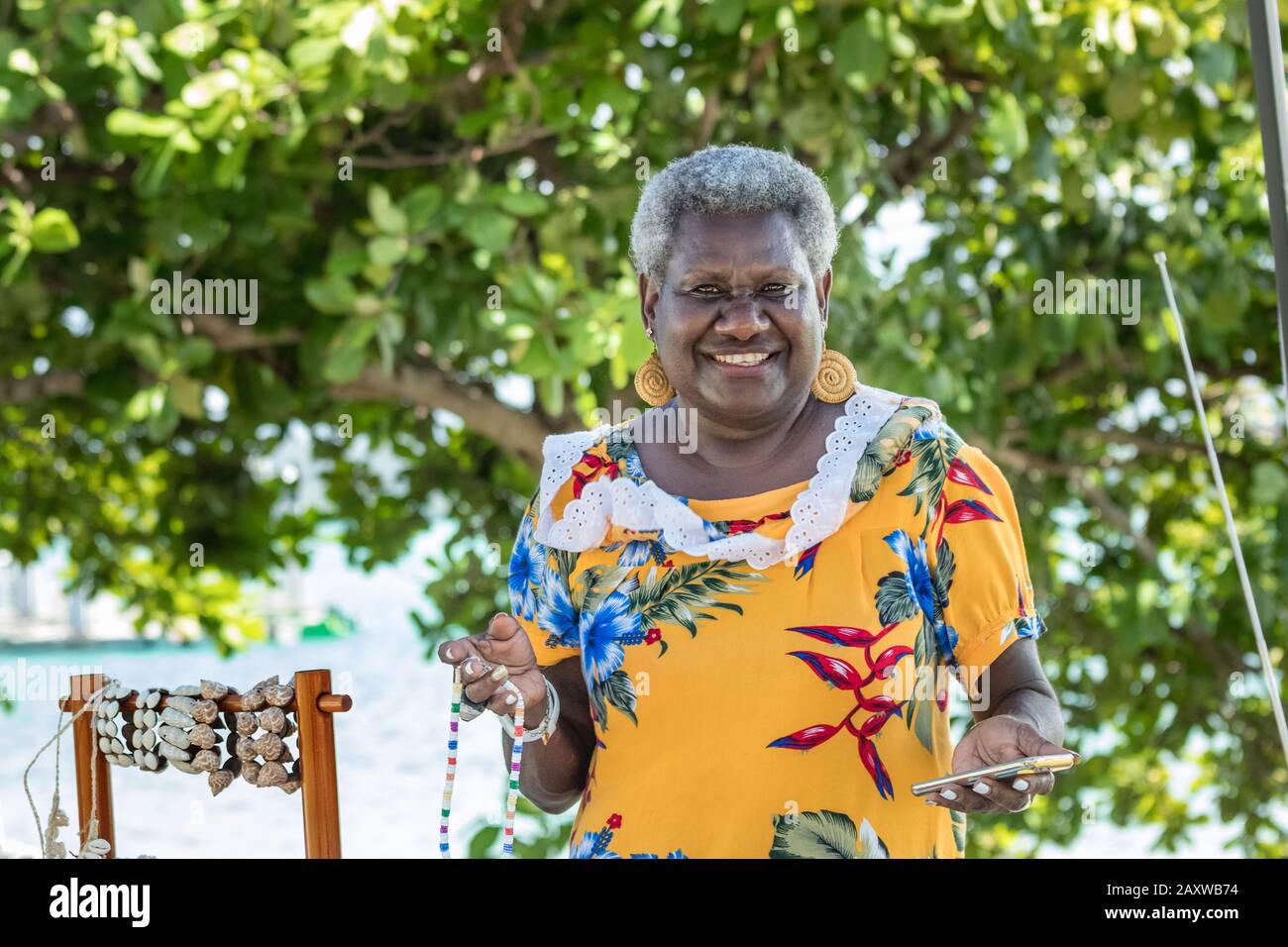 Portrait of a melanesian - australian artisan mature woman smiling ...