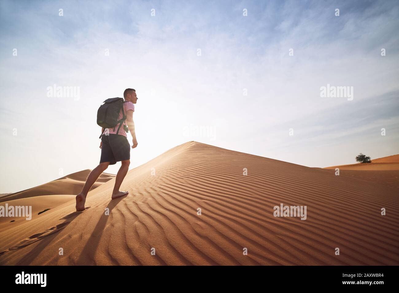 Desert dune man walking hi-res stock photography and images - Alamy