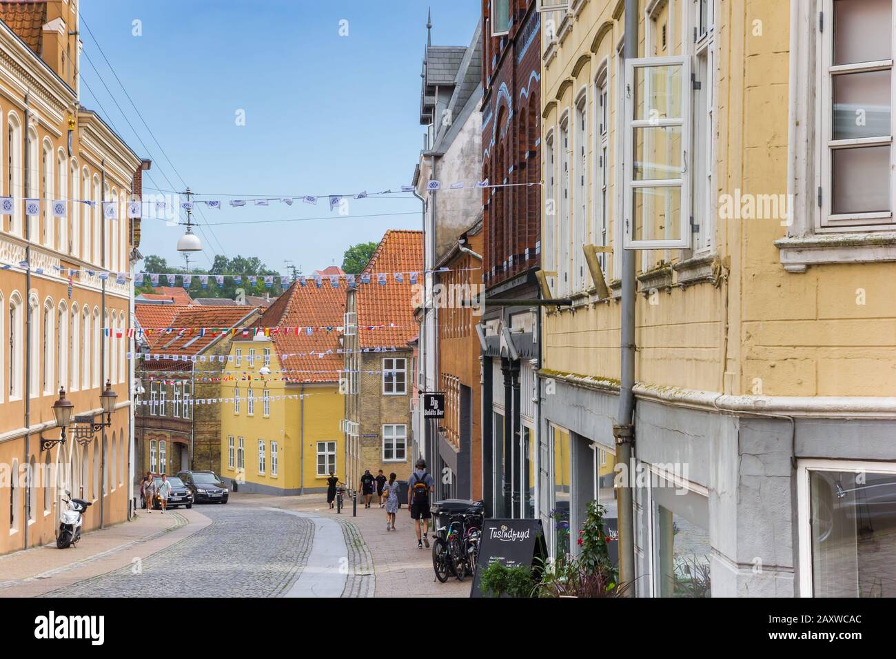 Historic houses and little flags in the center of Haderslev, Denmark ...