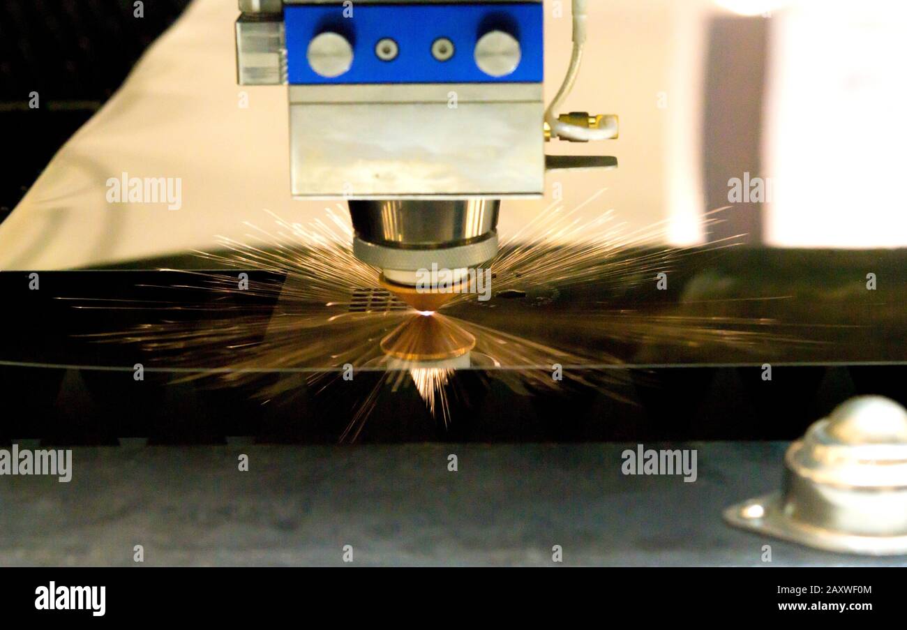 Fiber laser machines for metal cutting close-up. A laser beam cuts the ...