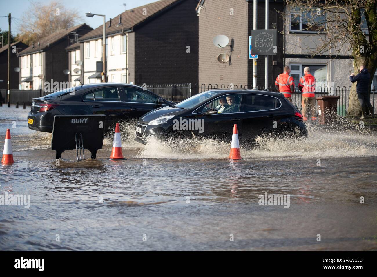 Bury, United Kingdom. 09 FEB 2020. People drive vehicle during Storm ...