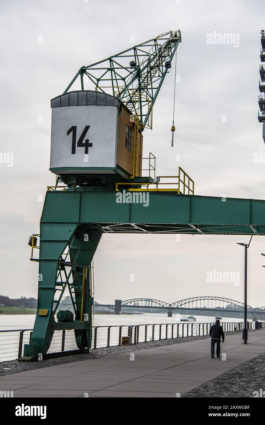 Quay wall with steel load crane Stock Photo - Alamy