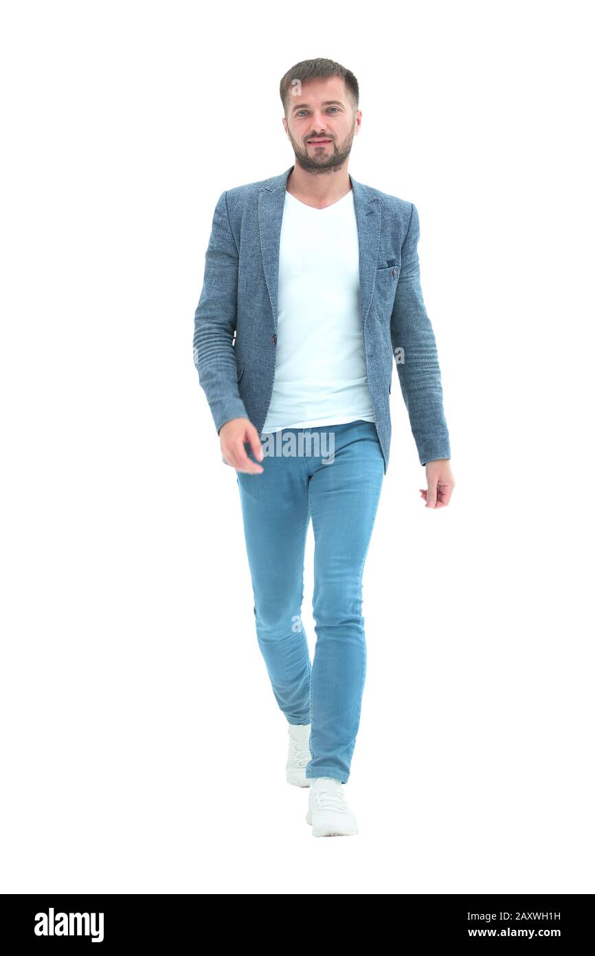 in full growth. confident young man striding forward Stock Photo - Alamy