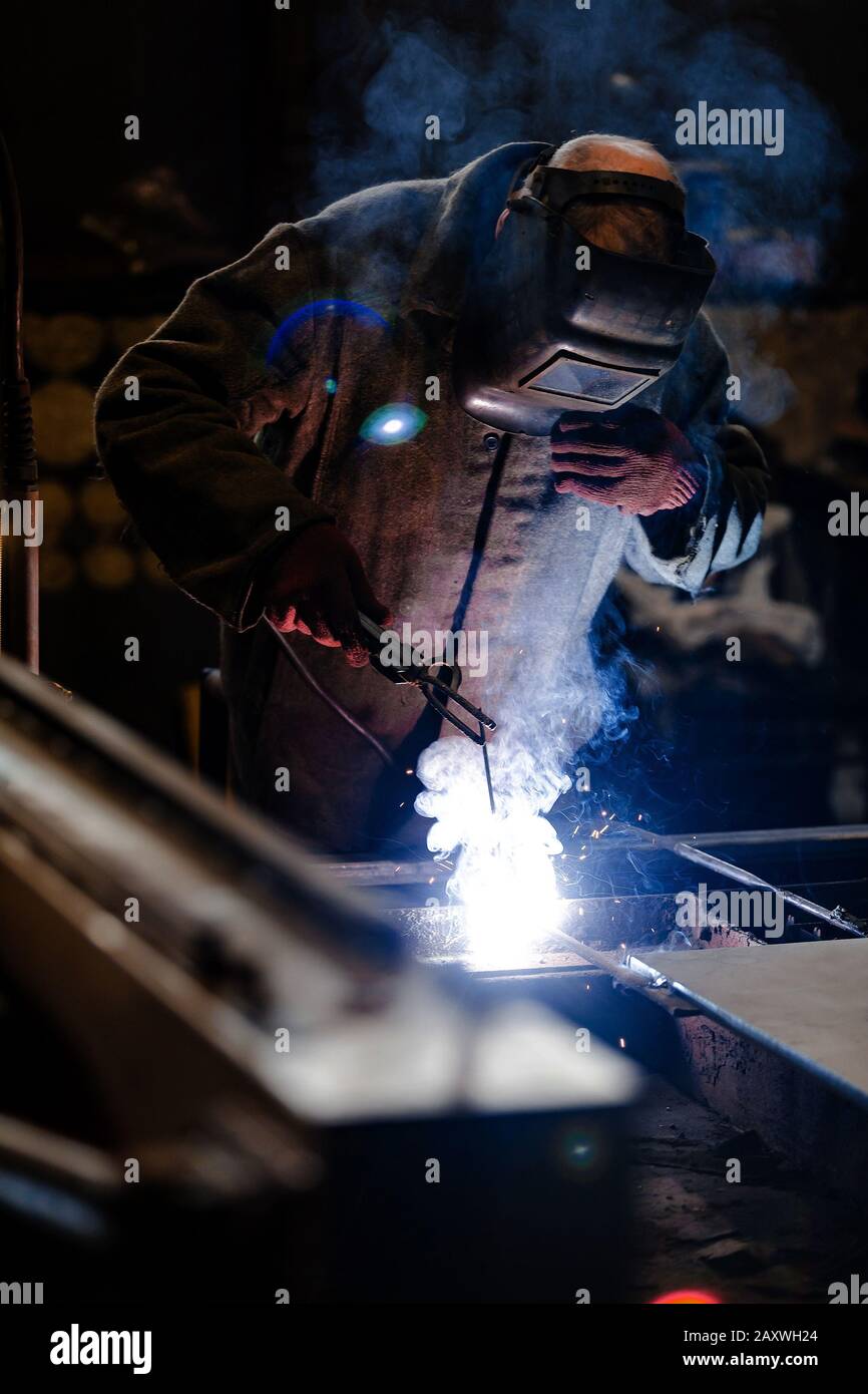Man welding in uniform hi-res stock photography and images - Alamy