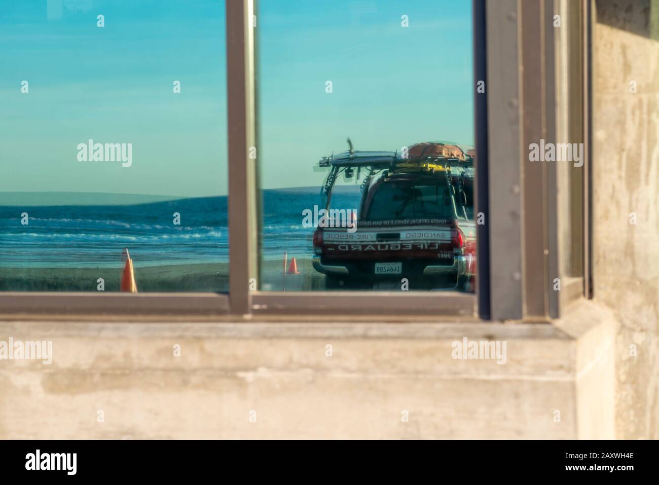 A reflection of the coast in the window of the lifeguard station at La ...
