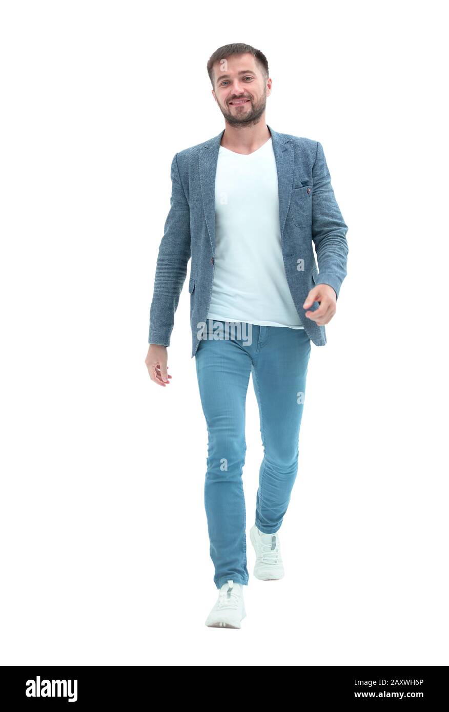 in full growth. confident young man striding forward Stock Photo - Alamy