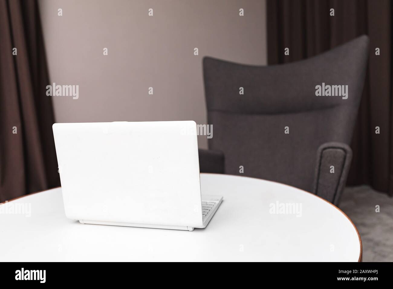 Open notebook pc in empty interior Stock Photo - Alamy