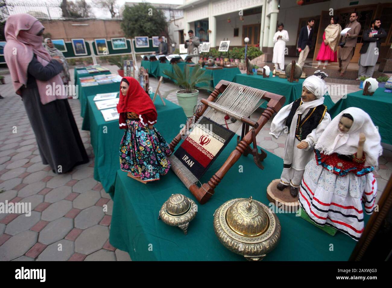 Visitors take keen interest at a stall during Exhibition in connection ...