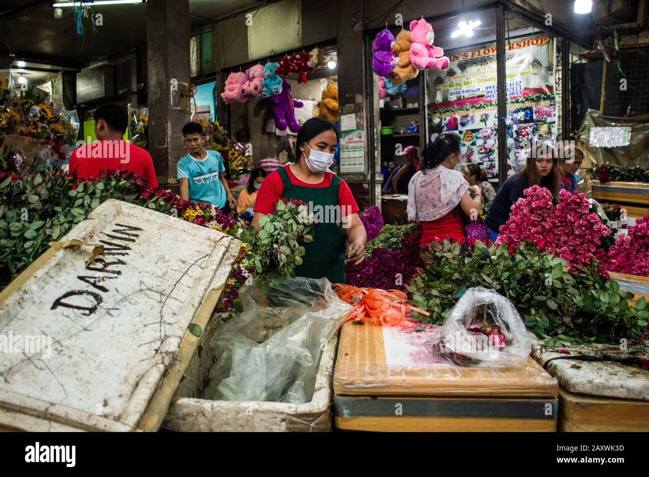 Manila, Metro Manila, Philippines. 13th Feb, 2020. A vendor wearing a ...