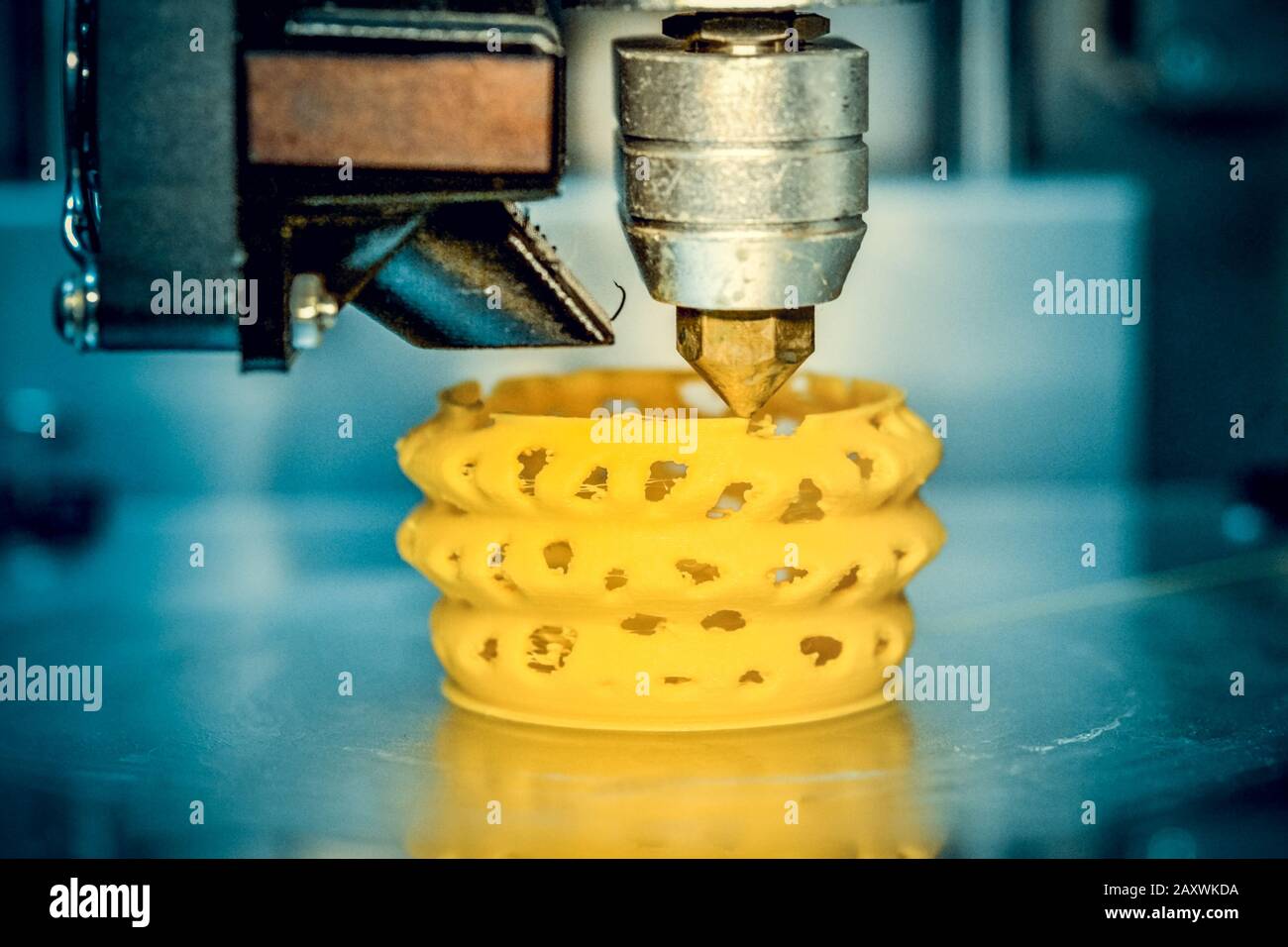 3d printer printing objects yellow form closeup. Modern technical 3D ...