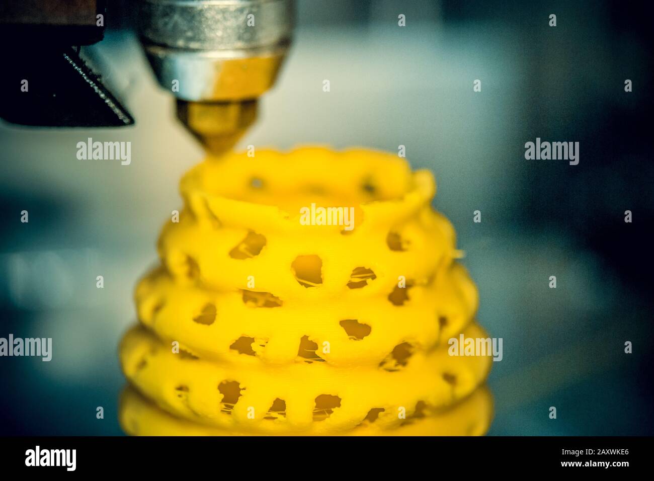 3d printer printing objects yellow form closeup. Modern technical 3D ...