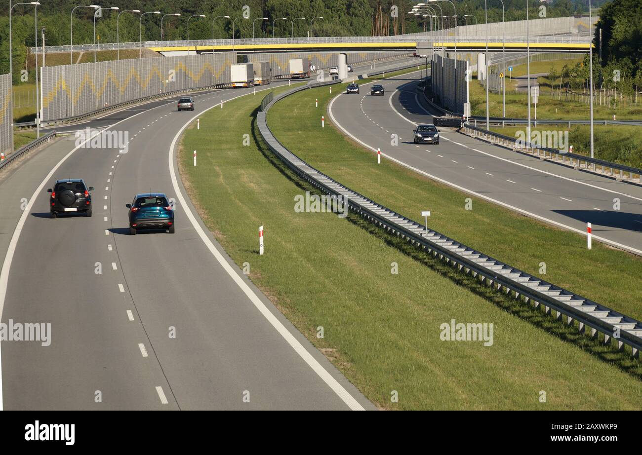 Noise protection. Car traffic on a fast-moving road built with sound ...