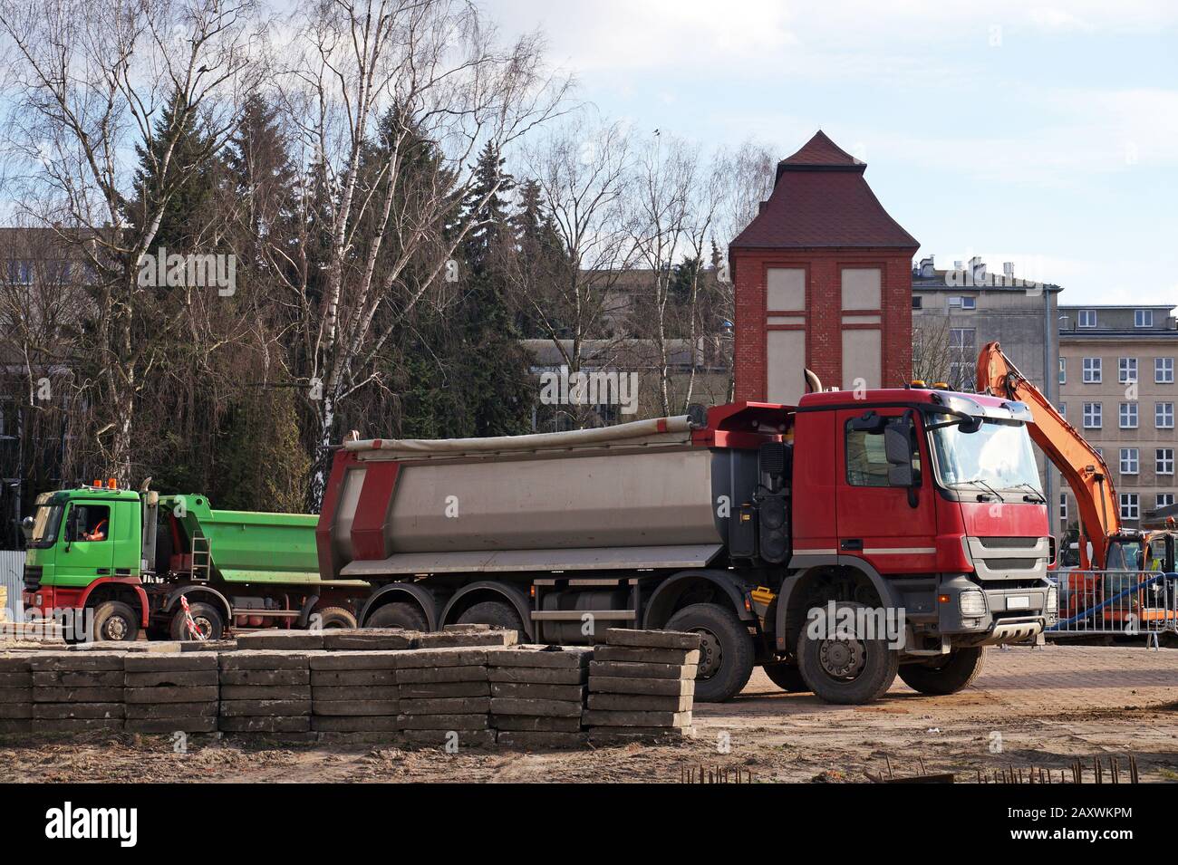 Construction site. Trucks waiting for the earth to be loaded by the ...