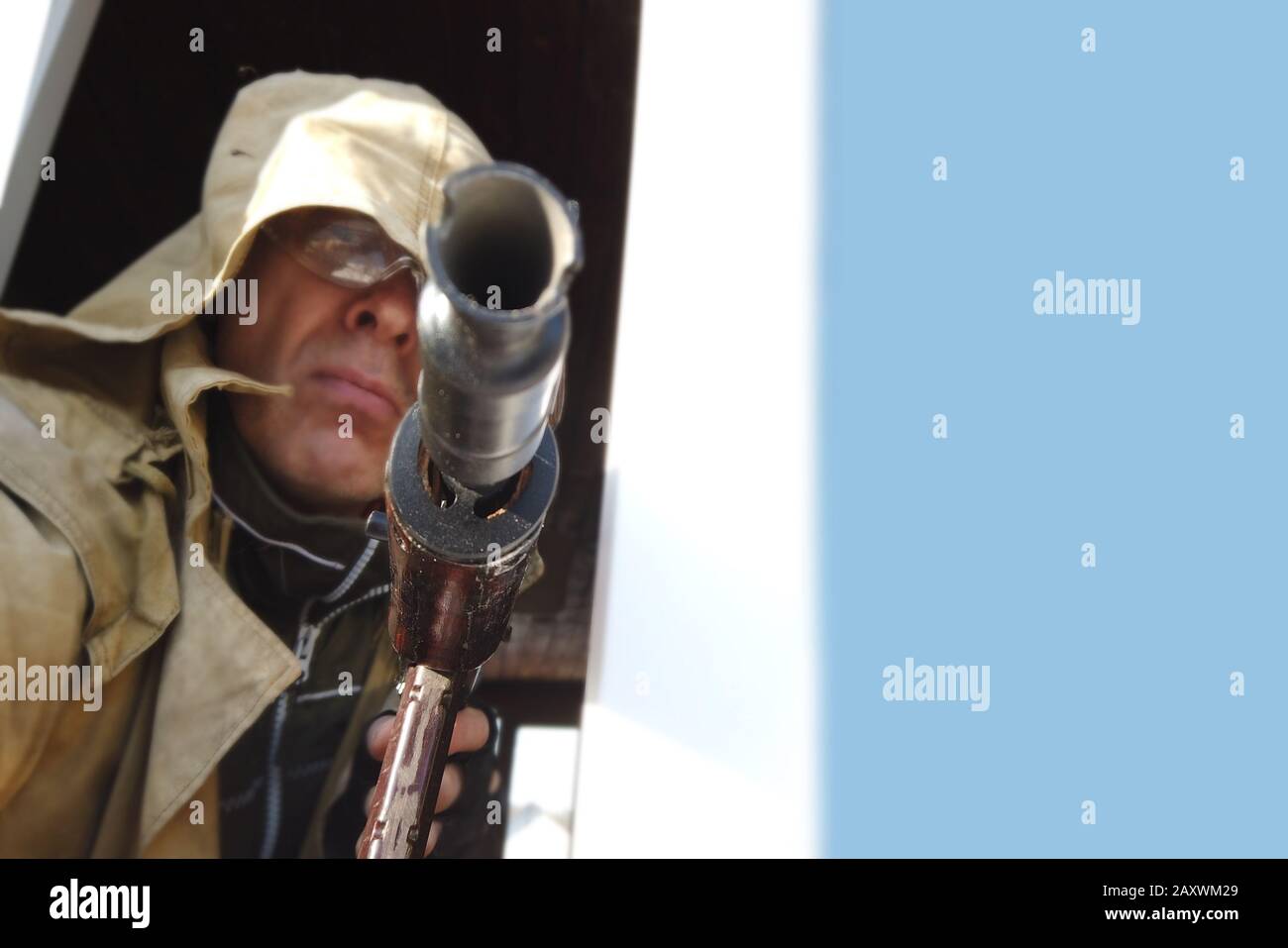 A shooter pointing a gun from a window, a blank space left for fither ...