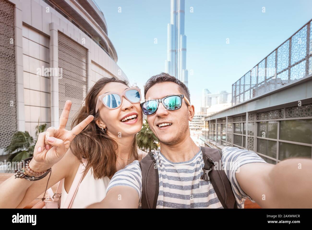 Two friends a man and a woman travel in Dubai and take a selfie photo ...