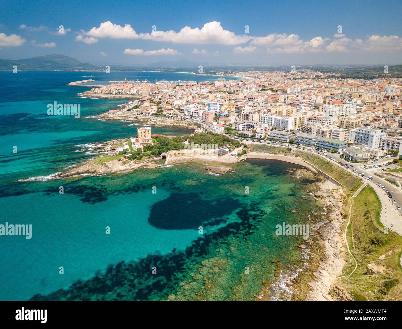 Aerial view of the city of alghero in the distance, sardinia, italy ...