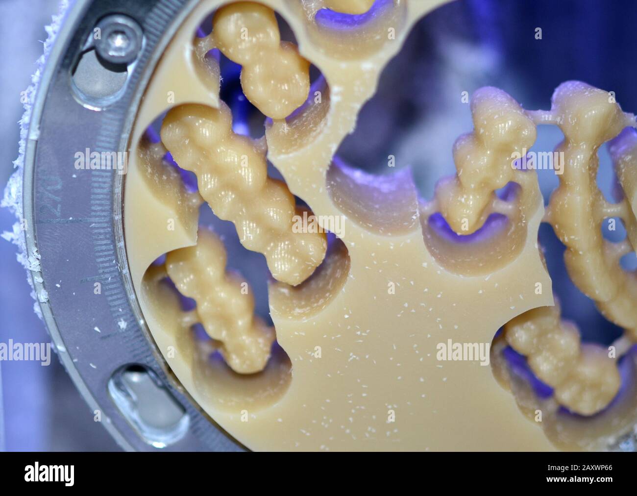 Dental milling machine carving out shape of human teeth close-up ...