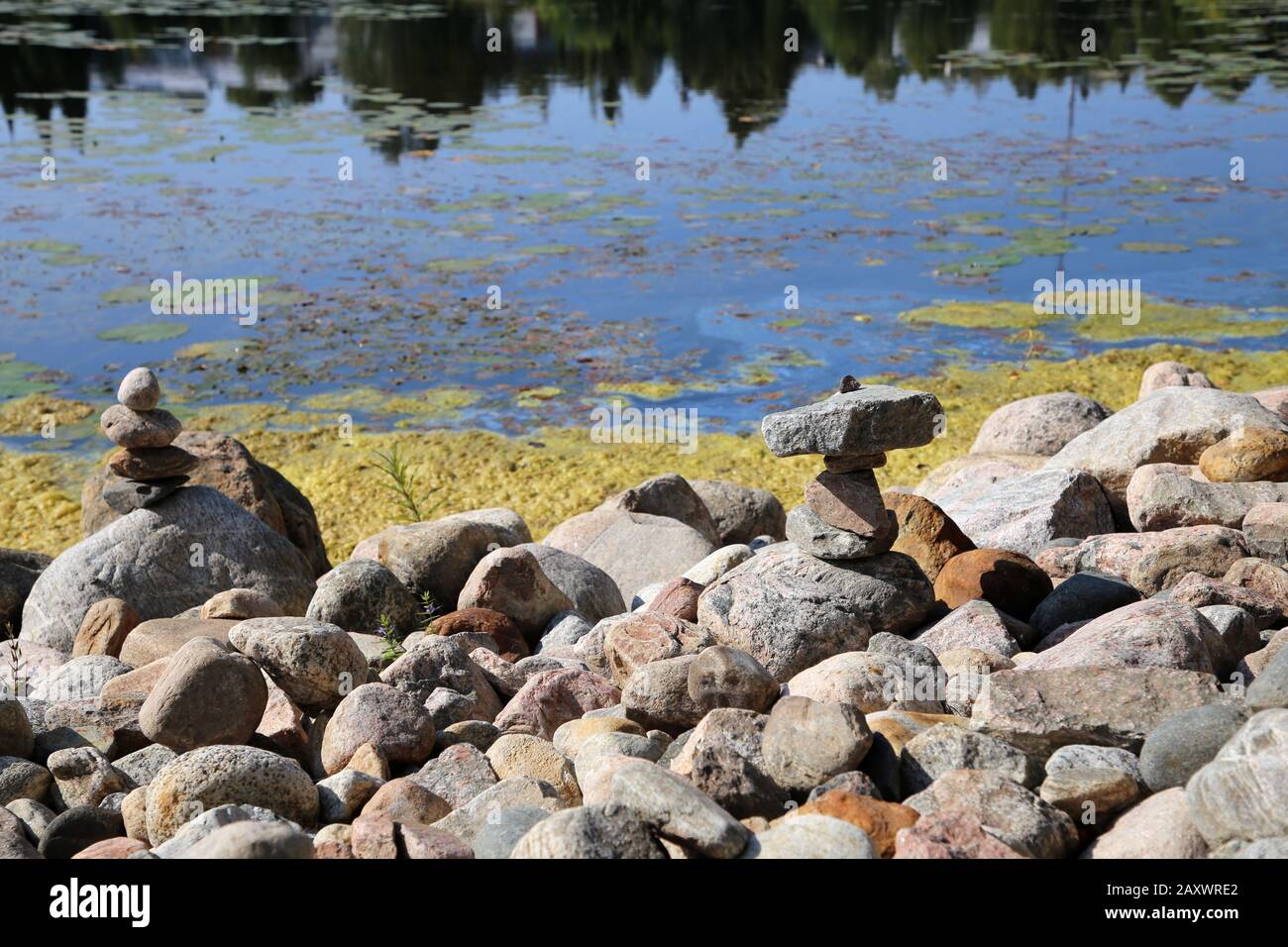 Stacks of natural rocks by the beach of lake Valkeinen in Kuopio ...
