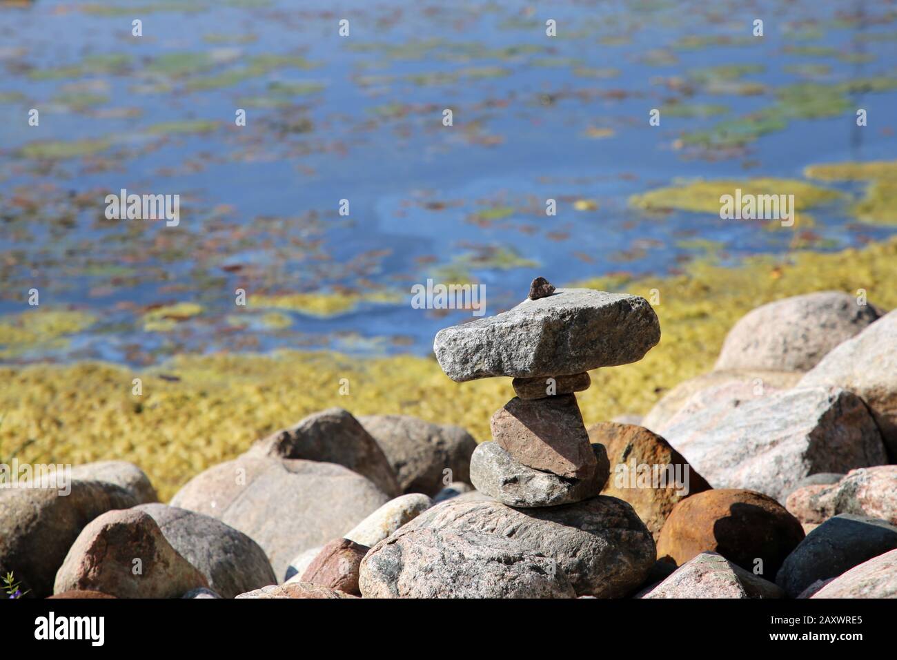 Stacks of natural rocks by the beach of lake Valkeinen in Kuopio ...