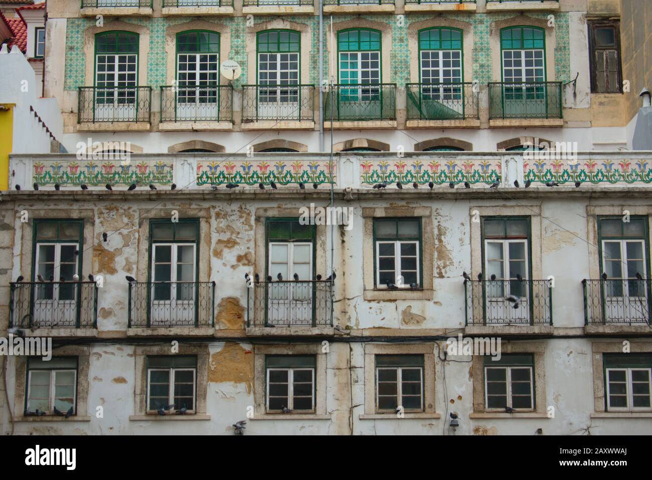 Facade of a worn down old buildings in Lisbon Stock Photo - Alamy