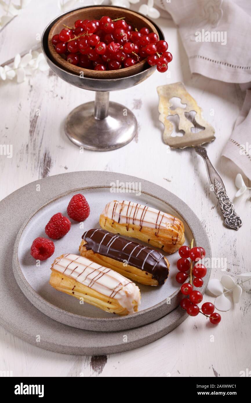 French pastries of choux pastry eclairs Stock Photo - Alamy