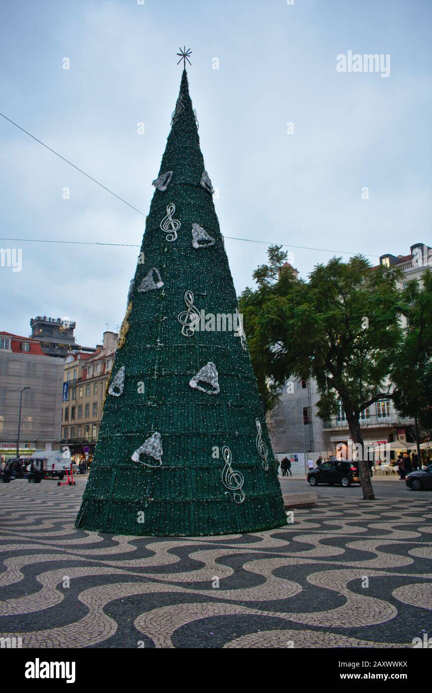 Christmas tree in a plaza square in day time in Lisbon Stock Photo - Alamy