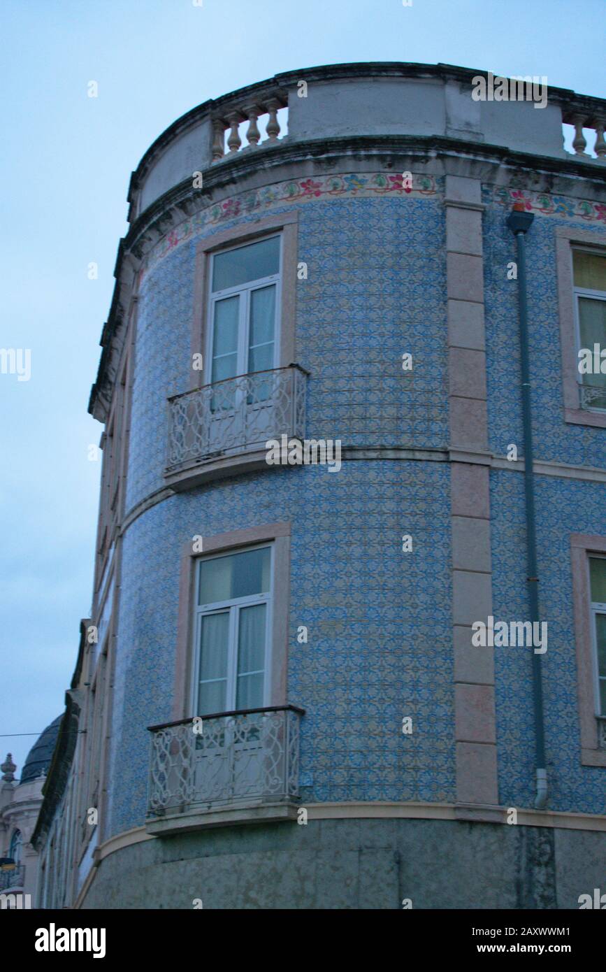 Traditional blue Portuguese side of tiled building with small balcony ...