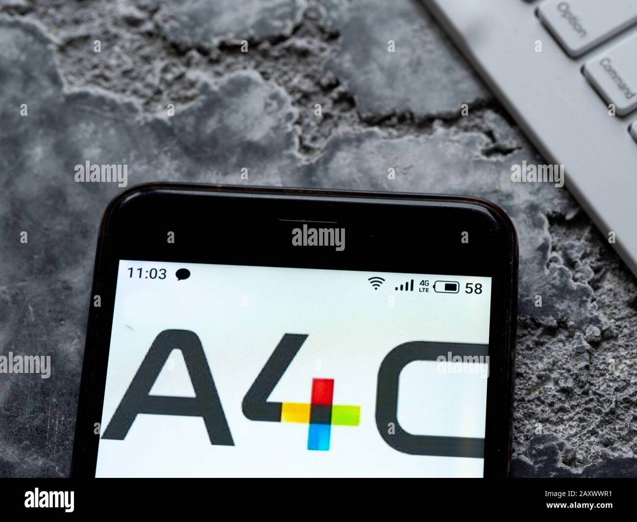 In this photo illustration an A4C logo seen displayed on a smartphone ...