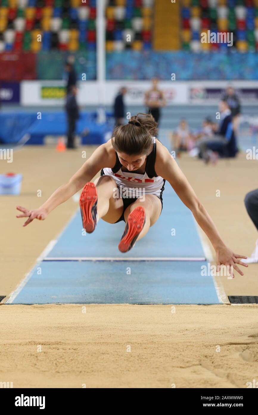 ISTANBUL, TURKEY - JANUARY 26, 2020: Undefined athlete long jumping ...