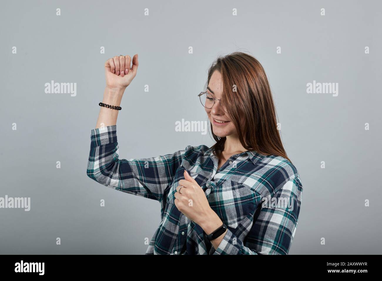 on grey background happy woman with glasses dancing Stock Photo - Alamy