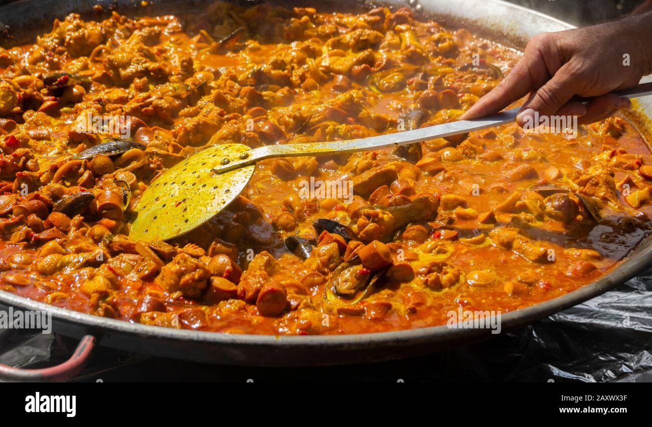Paella being prepared at outdoor event in Spain Stock Photo - Alamy