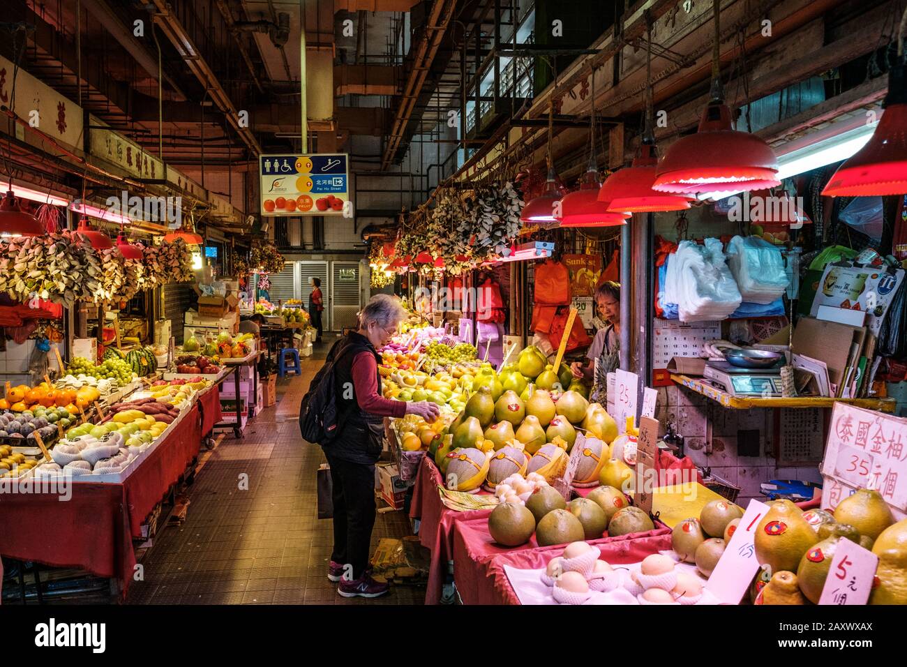 Hong Kong - November, 2019: People buying and selling groceries at shop ...
