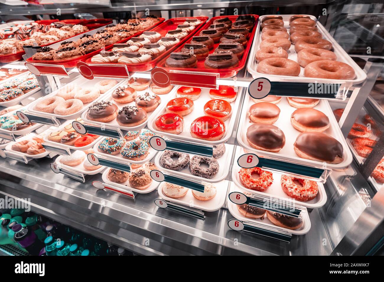 Tasty fresh donuts at confectionery shop counters for sale Stock Photo ...