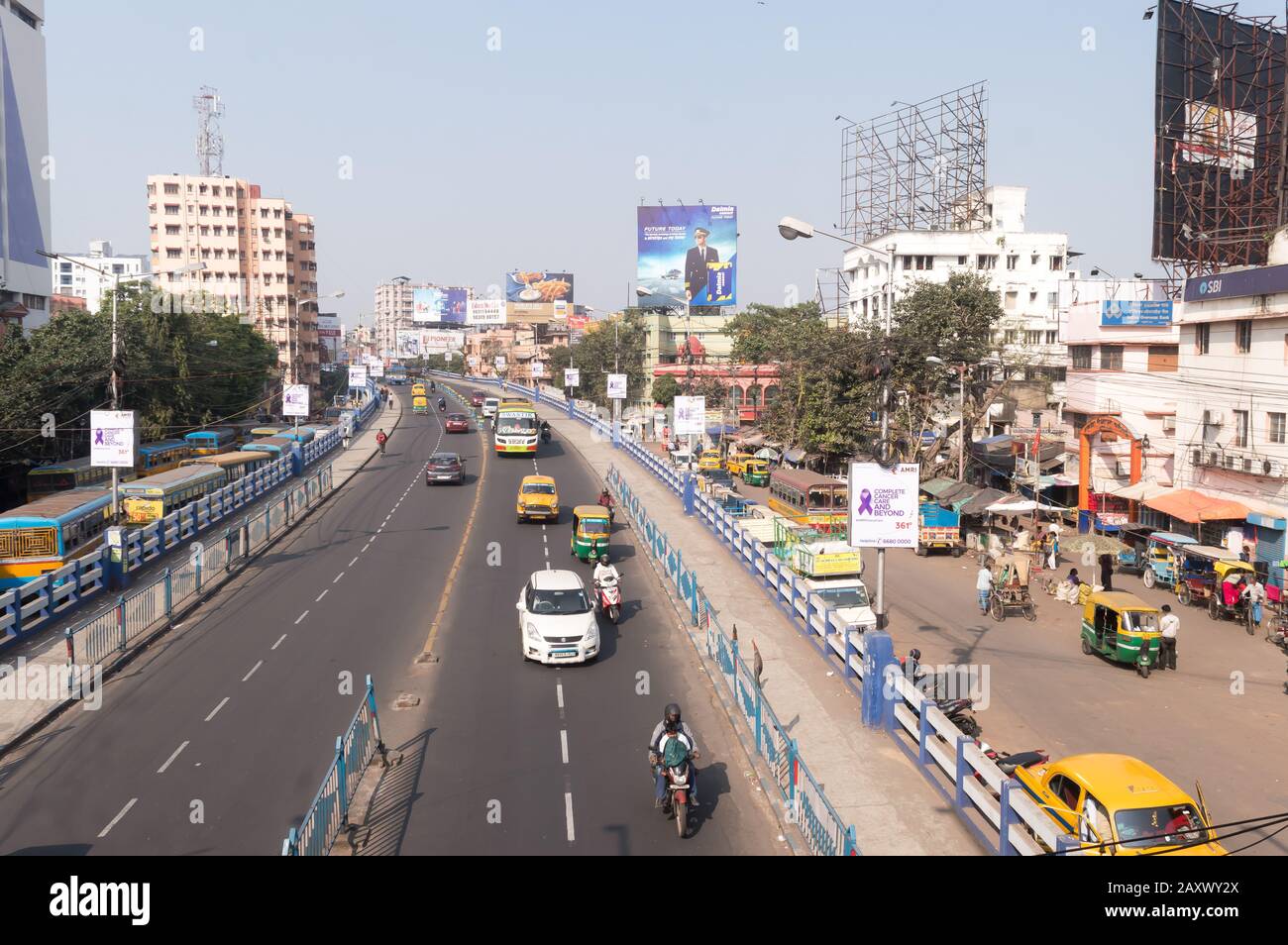 Traffic and pedestrians on crowded city streets in evening rush hour on ...
