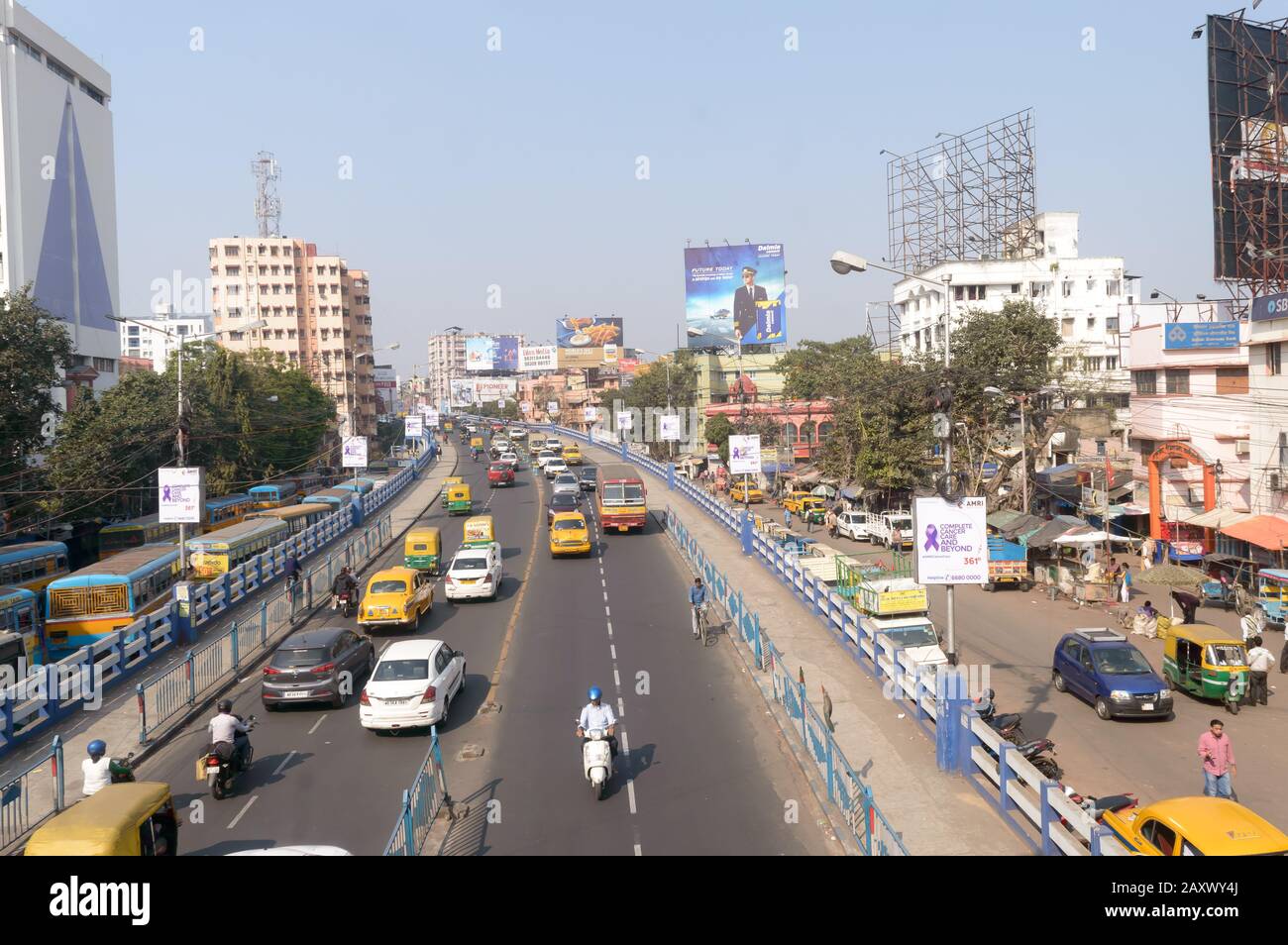 Traffic and pedestrians on crowded city streets in evening rush hour on ...