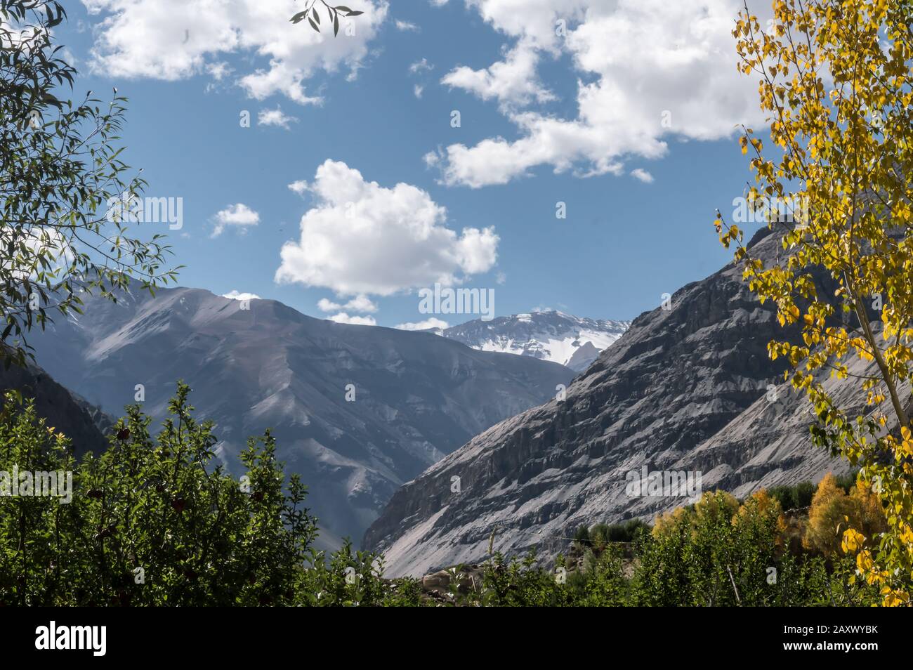 Distant Highland mountain hill range in summer with floating clouds ...