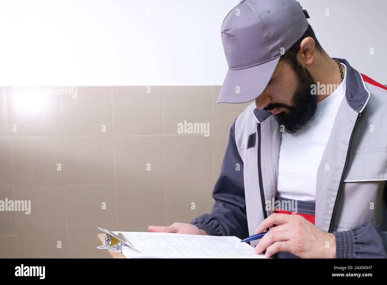 Young engineer taking notes control hi-res stock photography and images ...