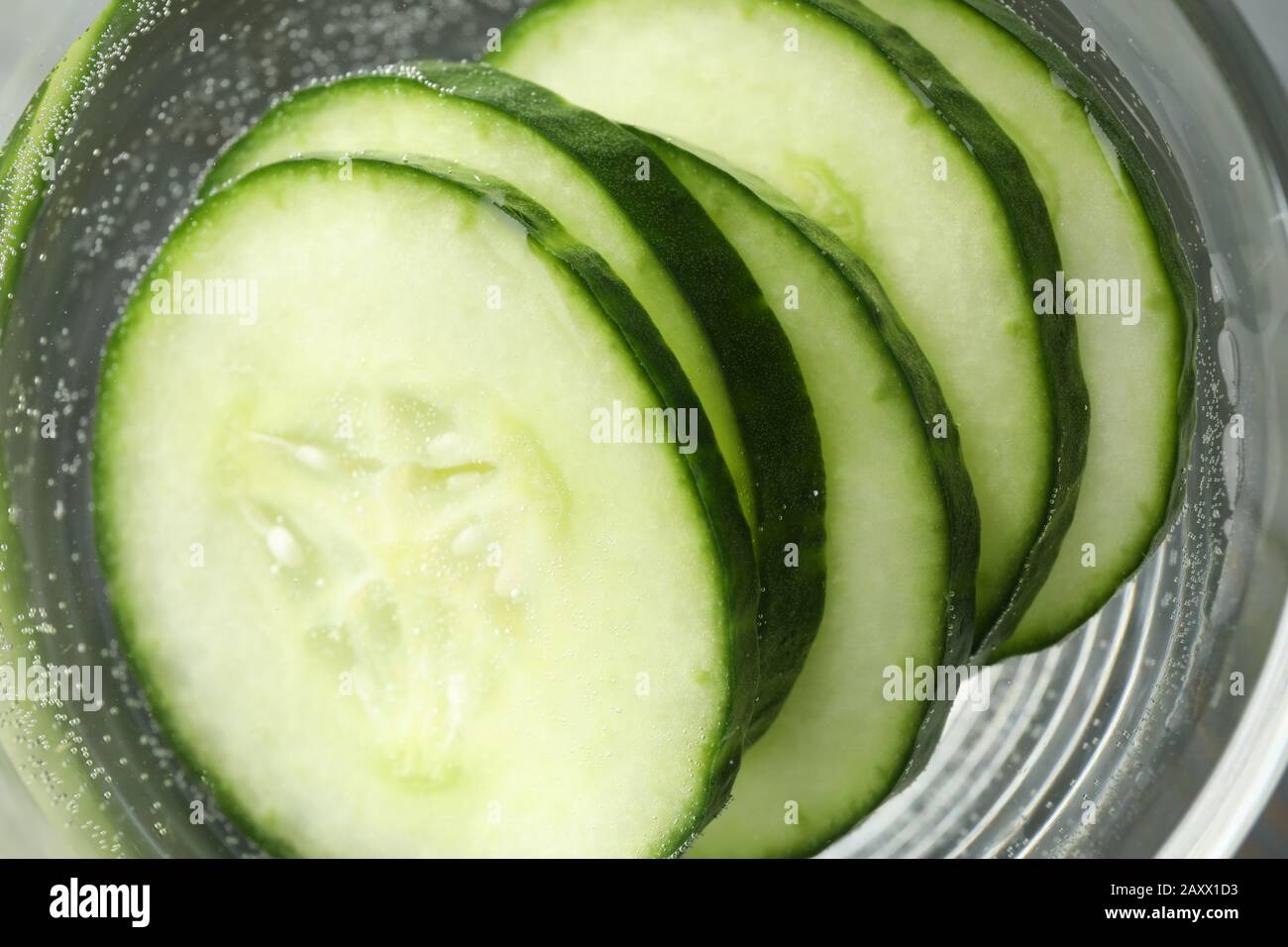 Glass with cucumber water and slices, close up Stock Photo - Alamy