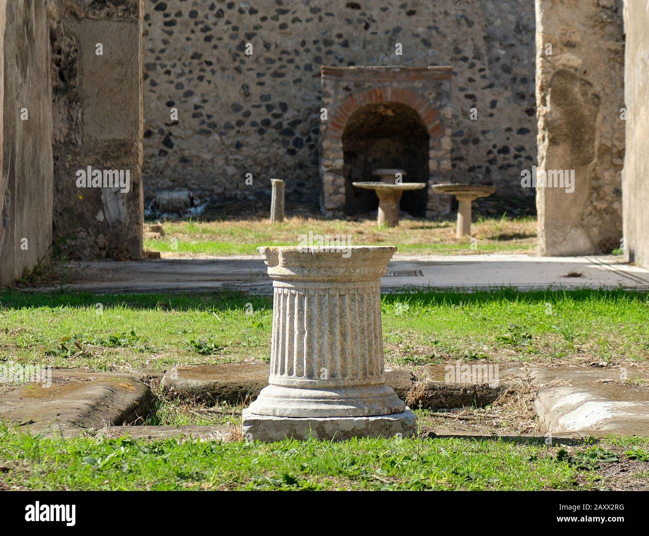 A short column or plinth in a courtyard of a Roman house in Pompeii ...