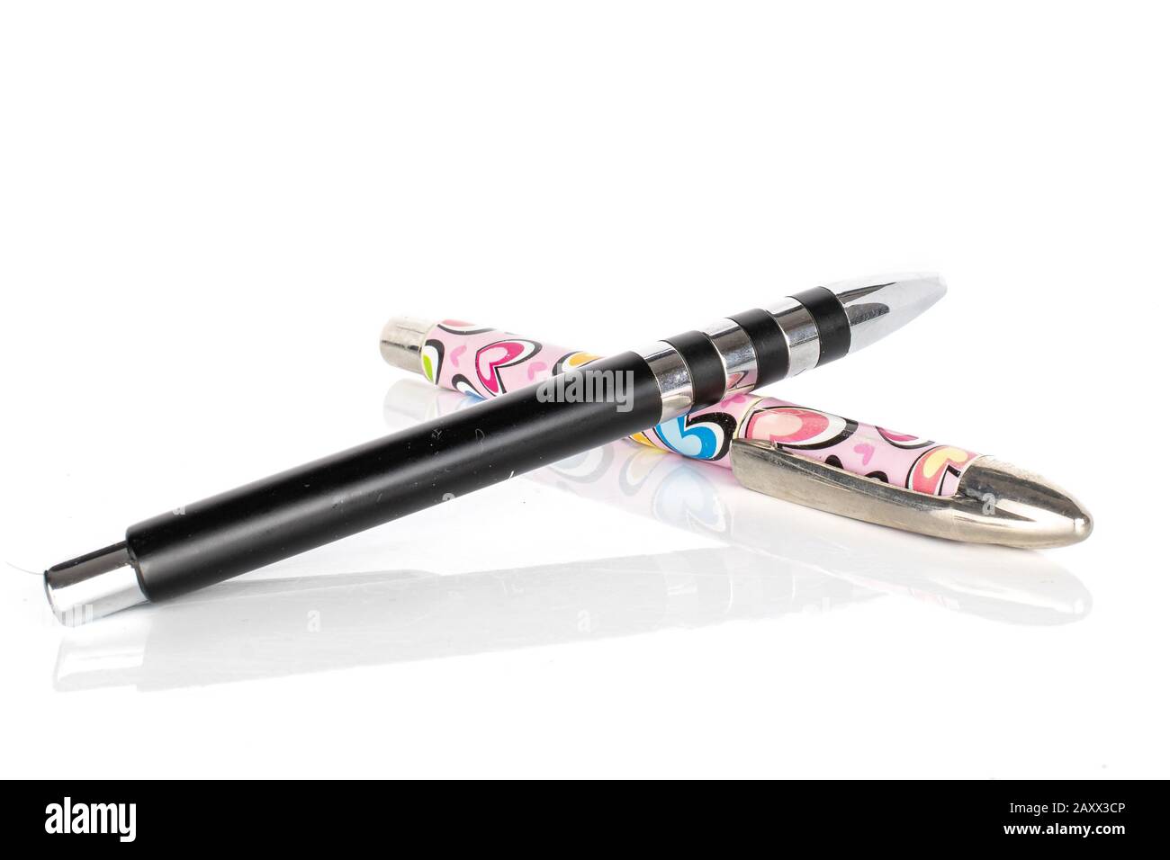 Group of two whole crossed writing ballpoint pen isolated on white ...