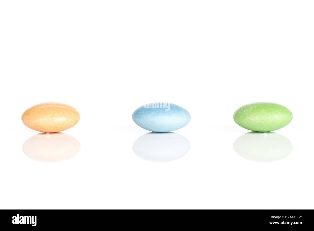 Group of three whole sweet colourful candy isolated on white background ...