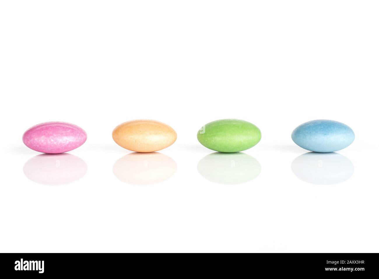 Group of four whole sweet colourful candy isolated on white background ...