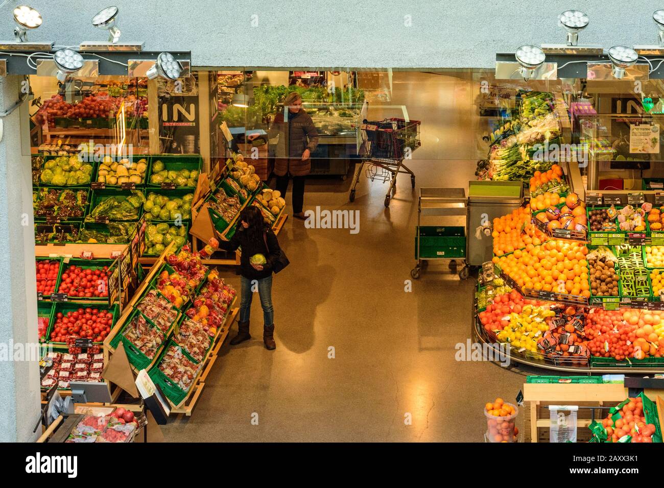 Wien, Vienna: fruit section, woman, Interspar hypermarket supermarket ...