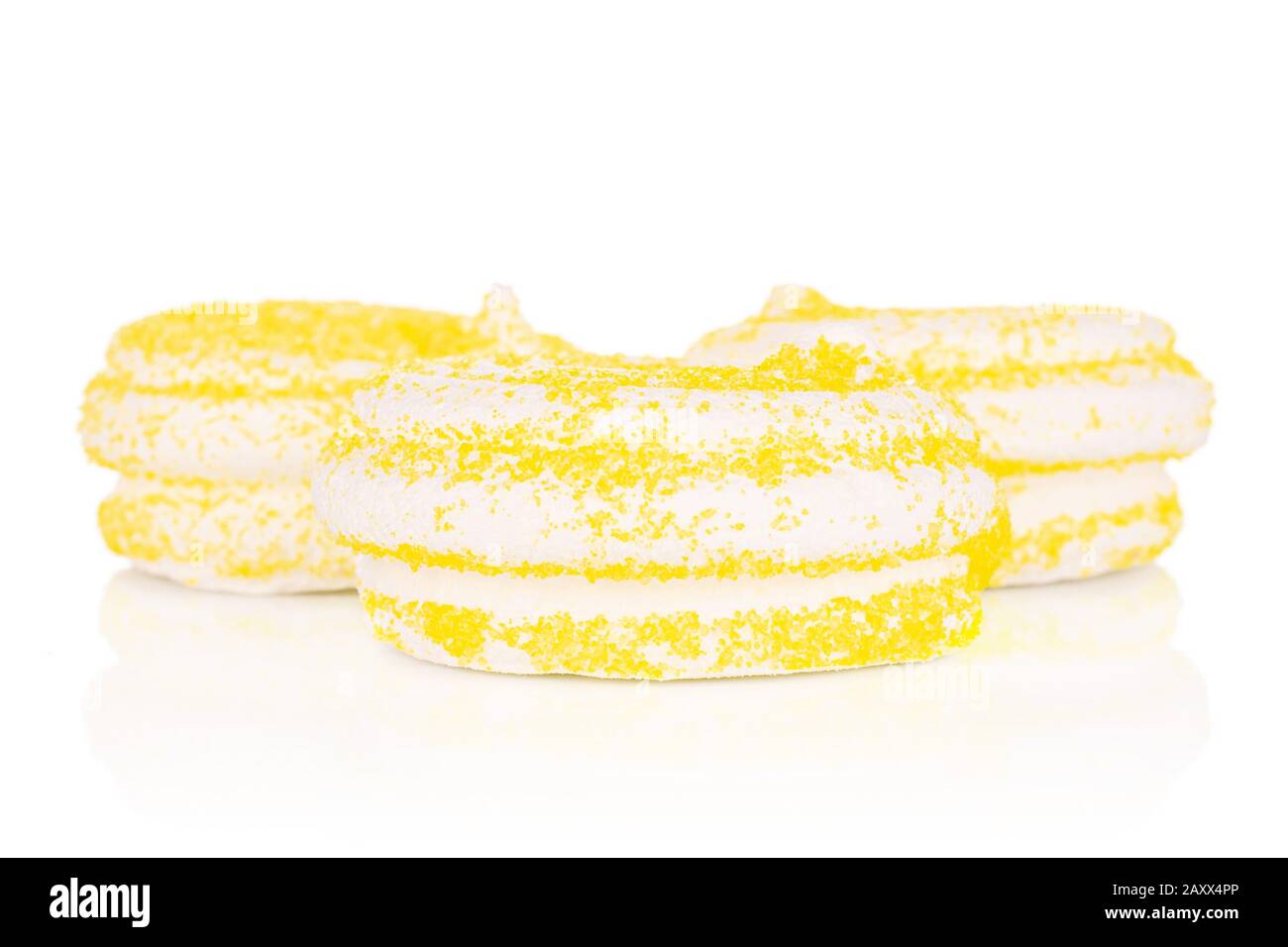 Group of three whole yellow sweet meringue isolated on white background ...