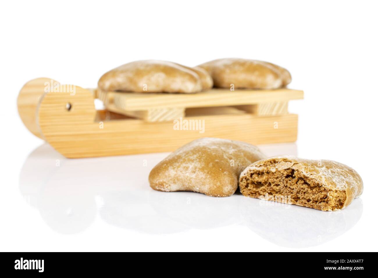 Group of three whole one half of sweet brown gingerbread with wooden ...