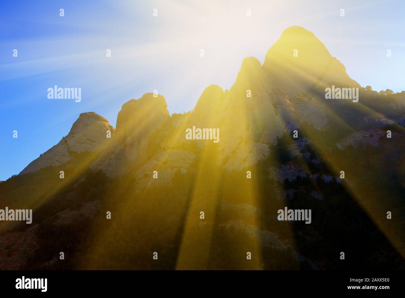 rays of sun over the mountain Stock Photo - Alamy