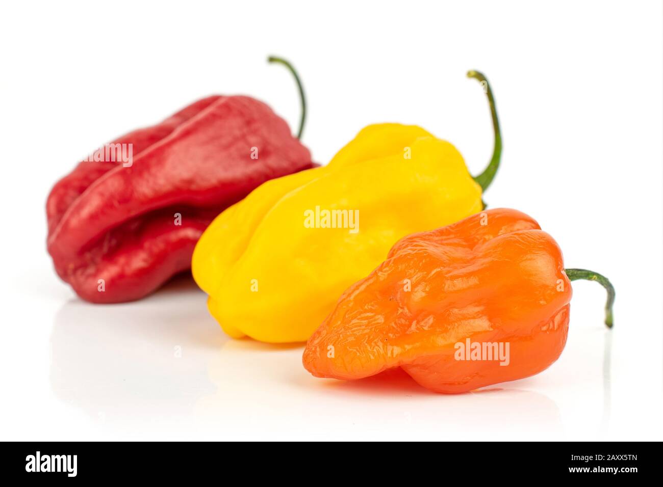 Group of three whole hot chili pepper isolated on white background ...