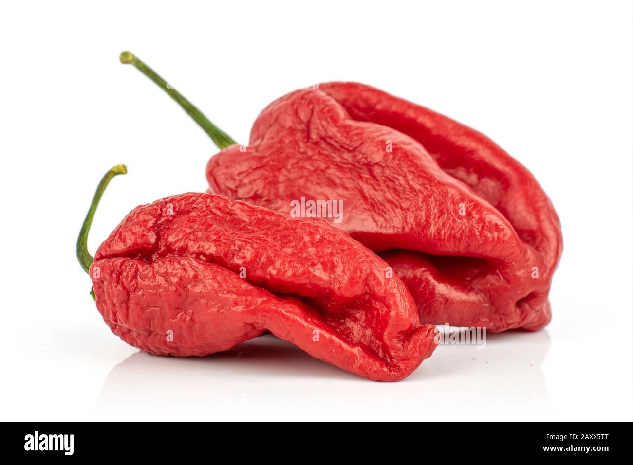 Group of two whole hot chili pepper both red isolated on white ...