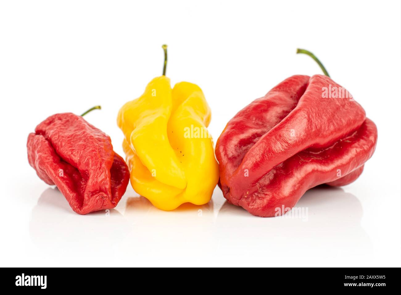 Group of three whole hot chili pepper isolated on white background ...